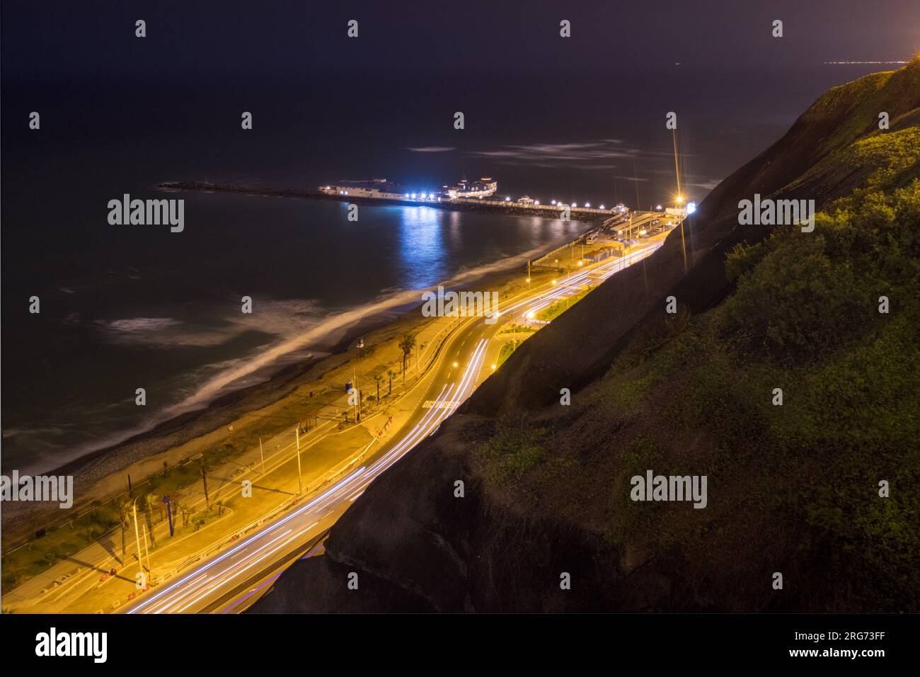 Night view of the ravines and streets against the Pacific Ocean, seen ...