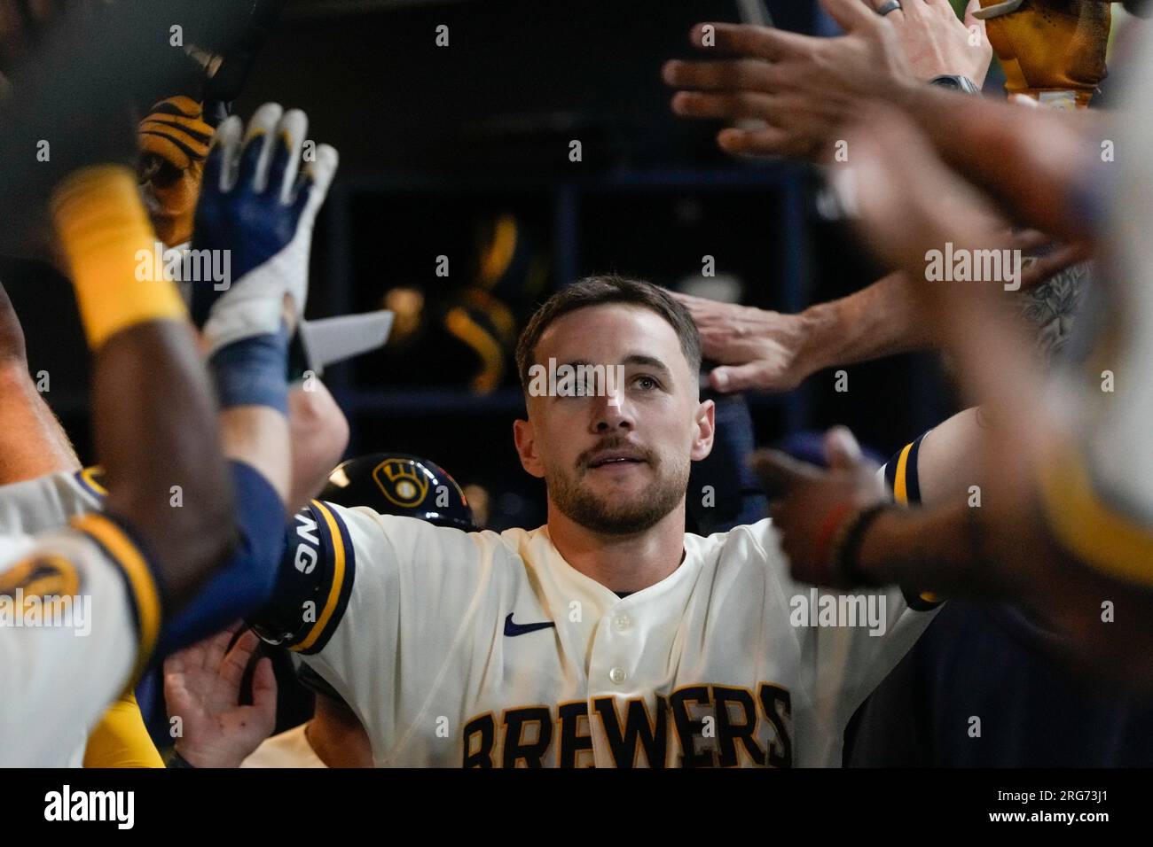 Milwaukee Brewers' Brice Turang is congratulated after hitting a two ...