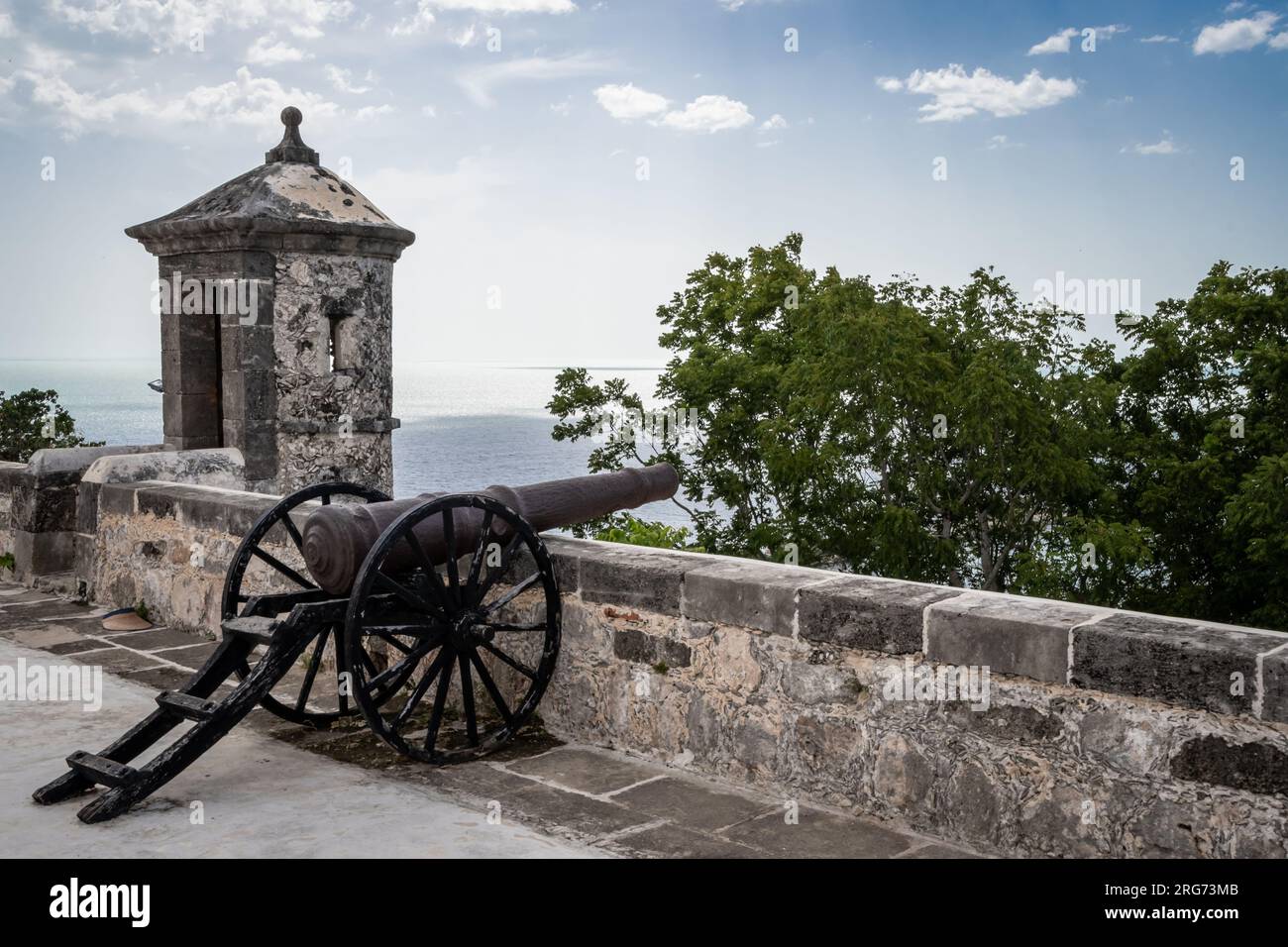 A cannon, watch tower and view of the ocean at the Museum of Ships and ...