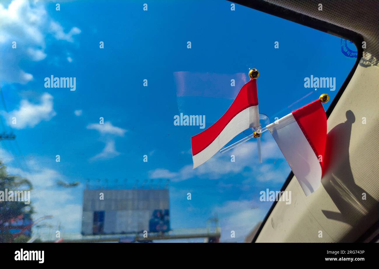 the Indonesian national flag in the car. Indonesian Independence day Stock Photo - Alamy
