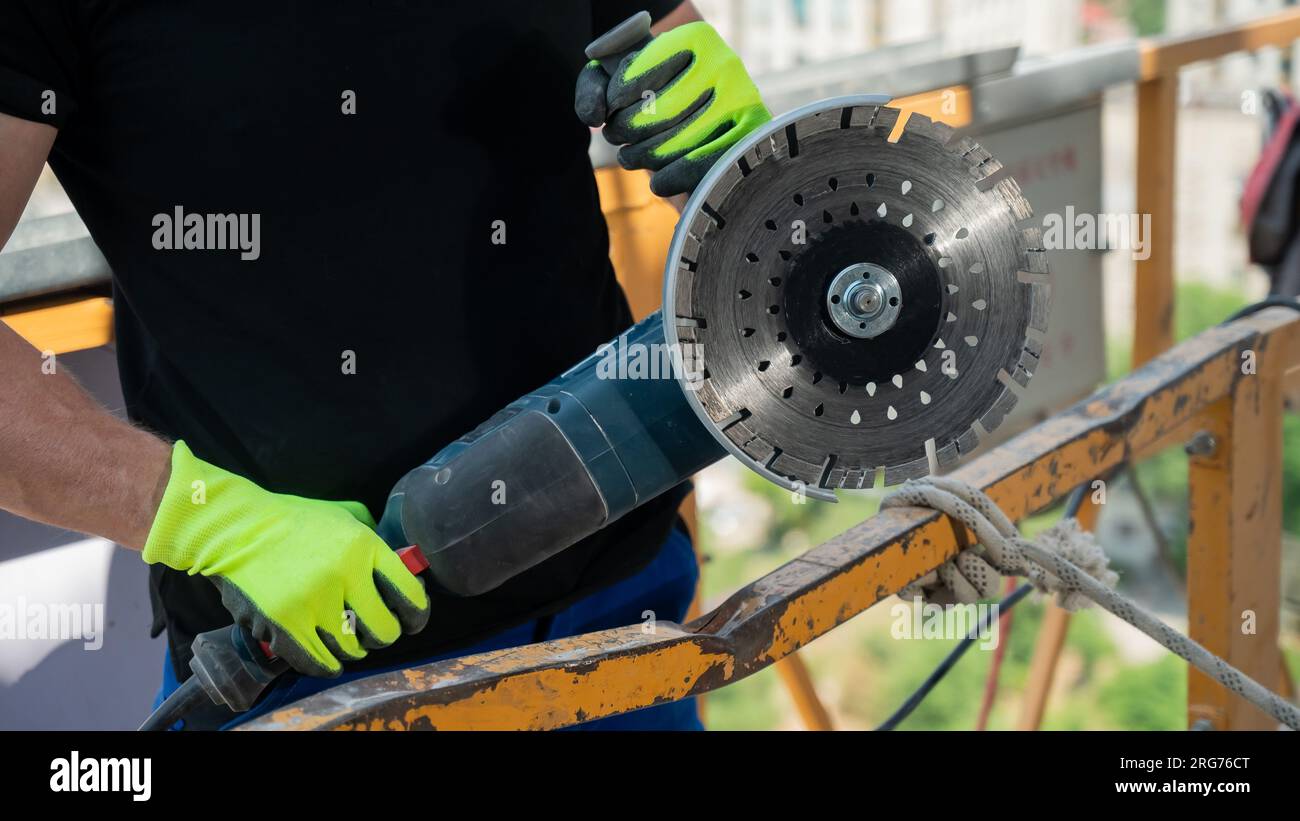 The master uses a diamond blade at a construction site Stock Photo - Alamy