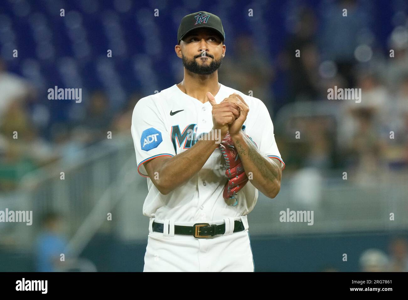 Miami Marlins starting pitcher Sandy Alcantara pauses on the mound ...