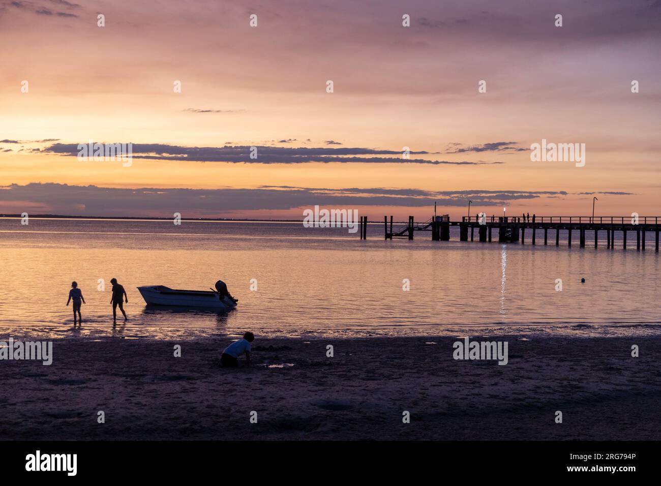 Fraser Island K'gari sunset over Kingfisher Bay with silhouettes of ...