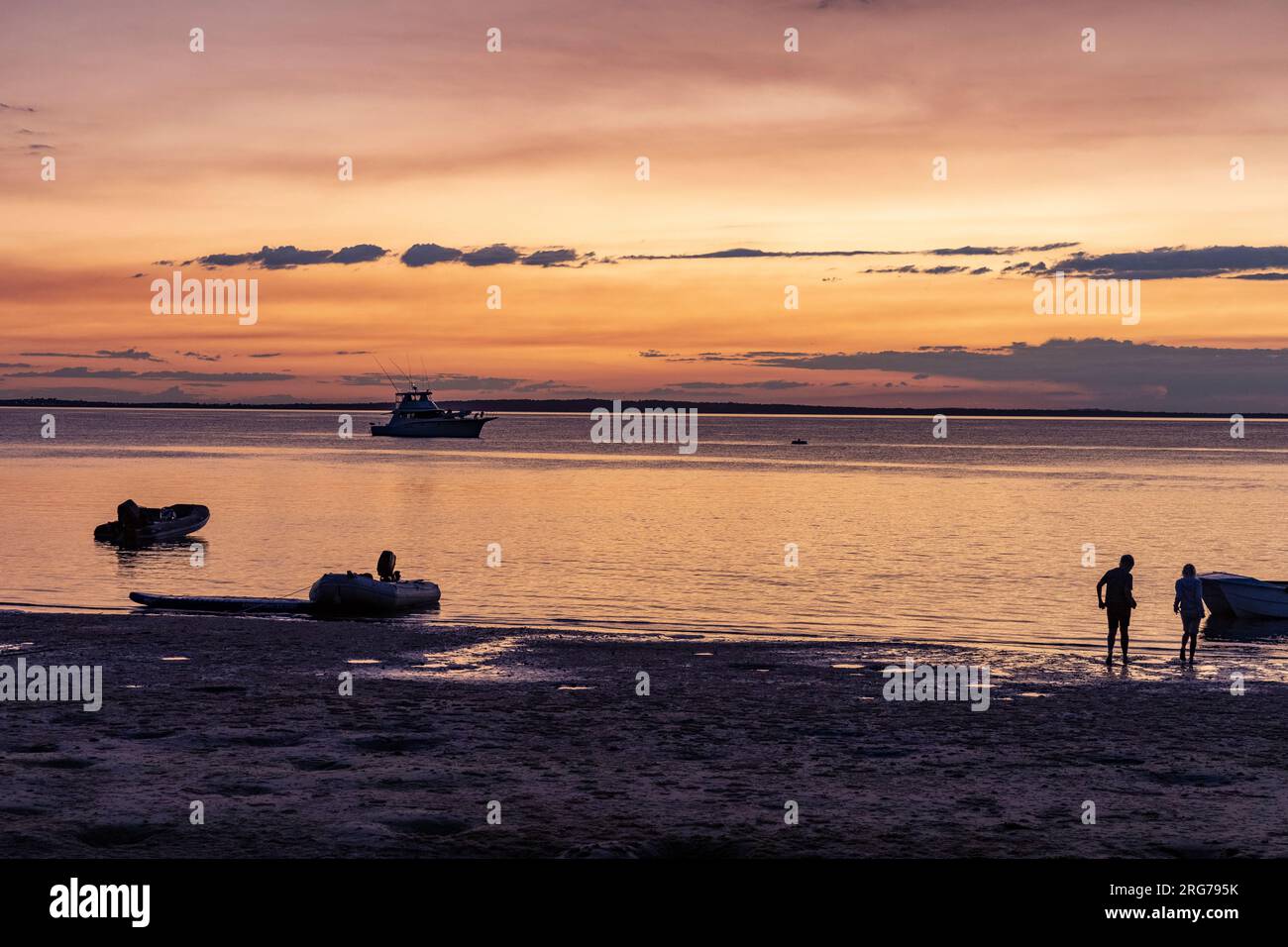 Fraser Island K'gari sunset over Kingfisher Bay with silhouettes of ...