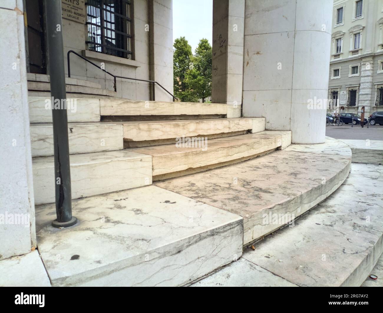 Entrance of a building with columns and a staircase in a square of an ...