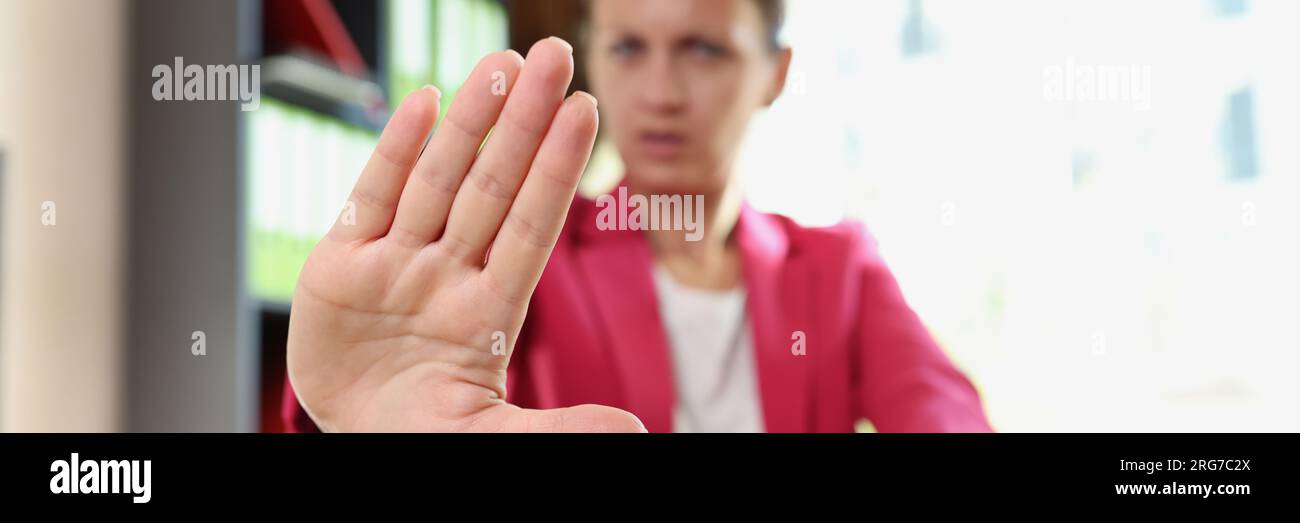 Woman in office shows gesture of refusal and disapproval Stock Photo ...