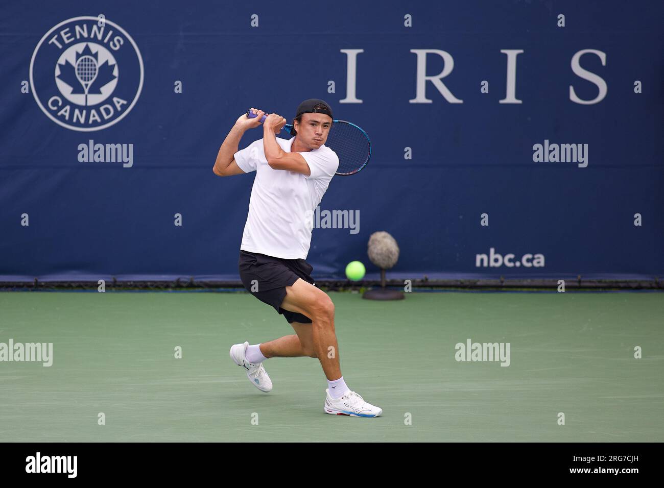 Taro Daniel of Japan plays a backhand during his men's first round ...