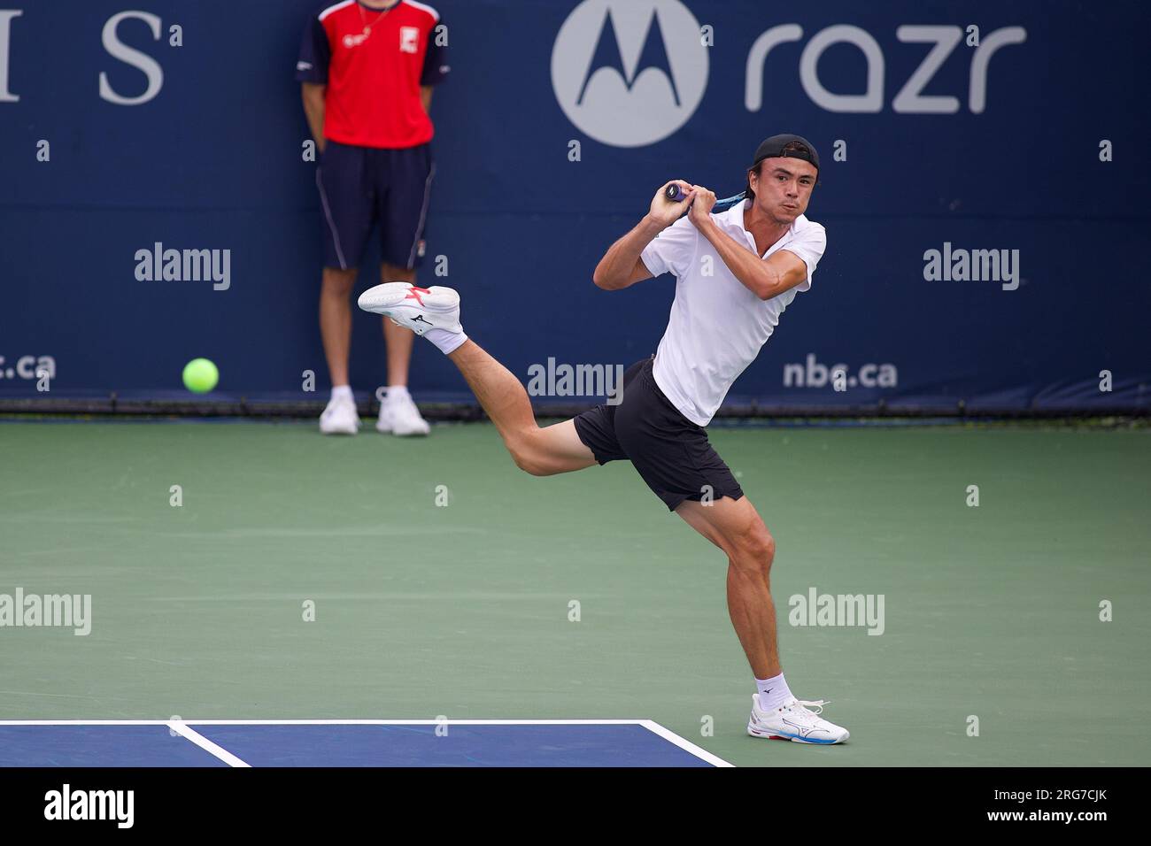 Taro Daniel of Japan plays a backhand during his men's first round ...