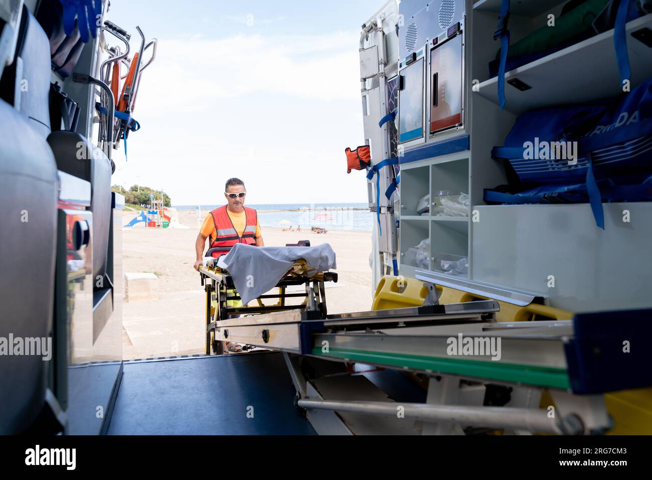 Frontal view from inside an ambulance of a medical worker taking a ...