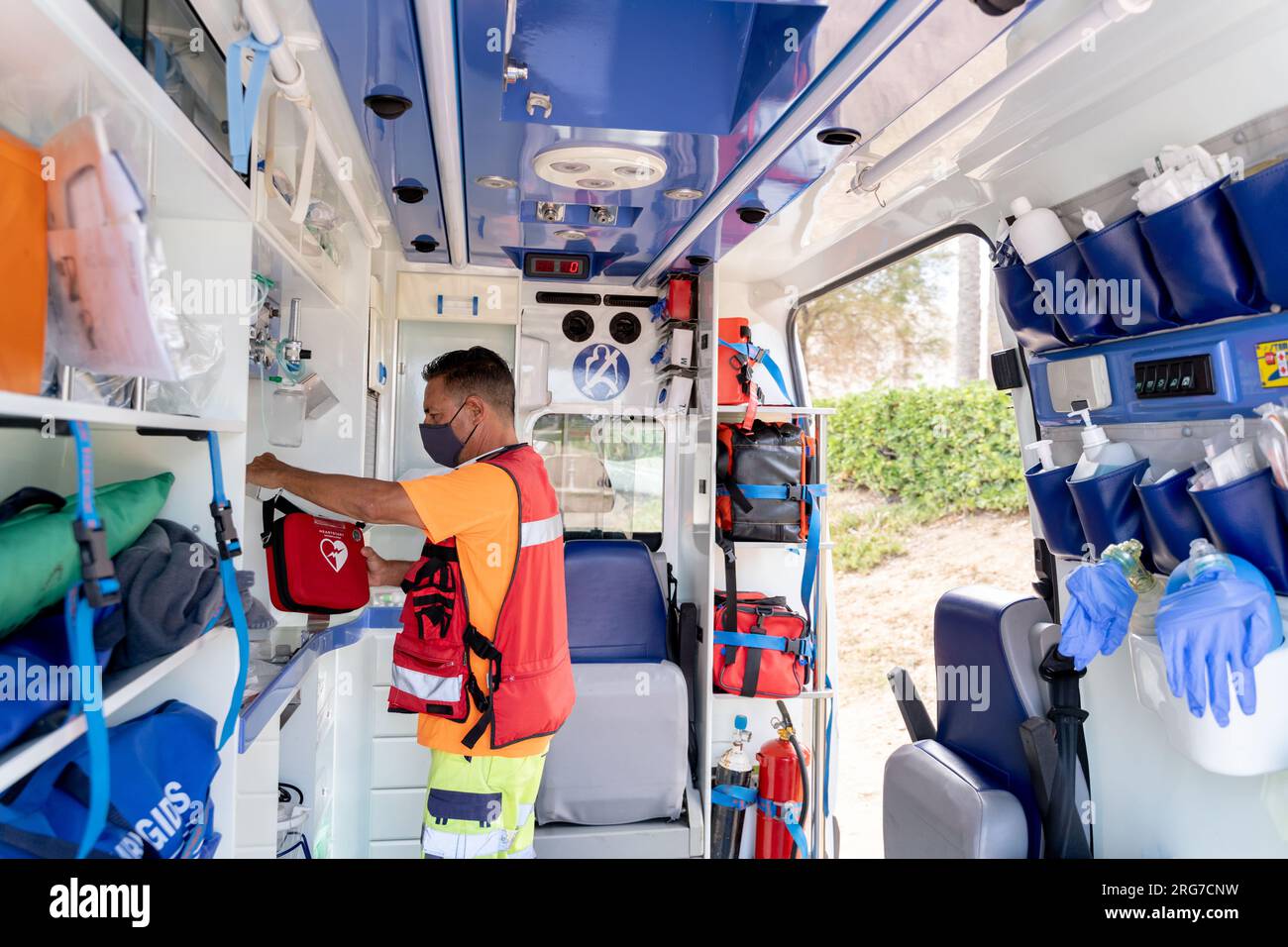 Wide view of Lifeguard using equipment inside an ambulance Stock Photo ...