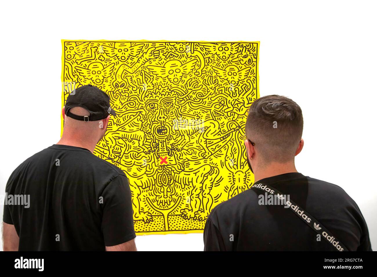two men admire painting by gay artist Keith Haring who died of Aids in ...