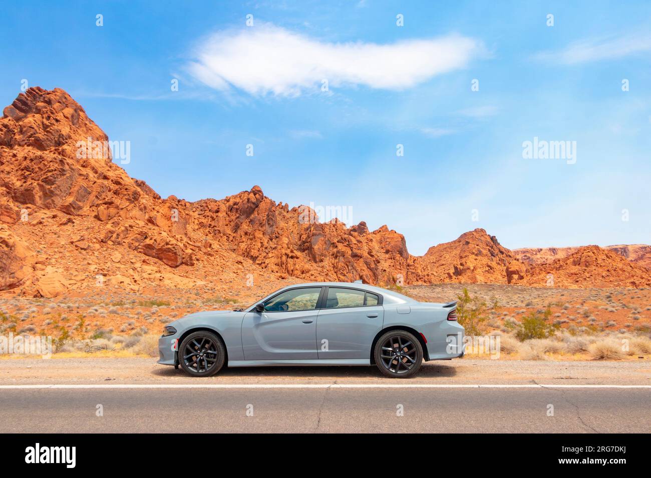 side view grey 2023 Dodge charger Hemi sports muscle car in fire state ...