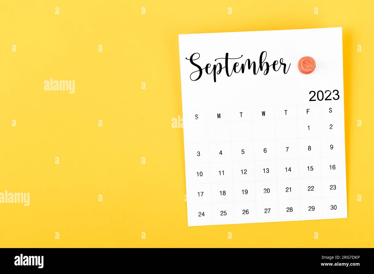 September 2023 and wooden push pin on yellow background Stock Photo - Alamy