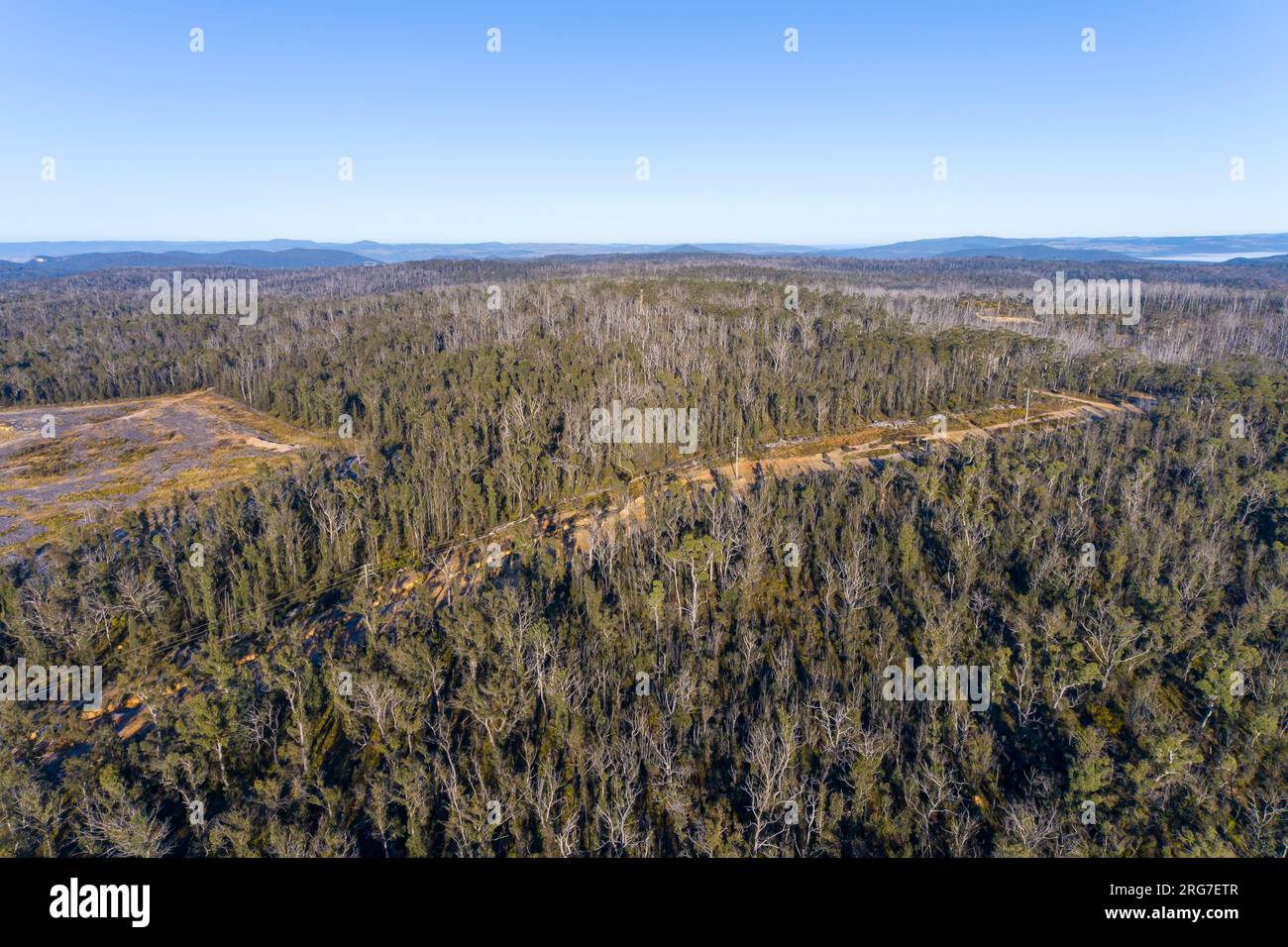 Drone aerial photograph of telephone lines and a dirt track running ...