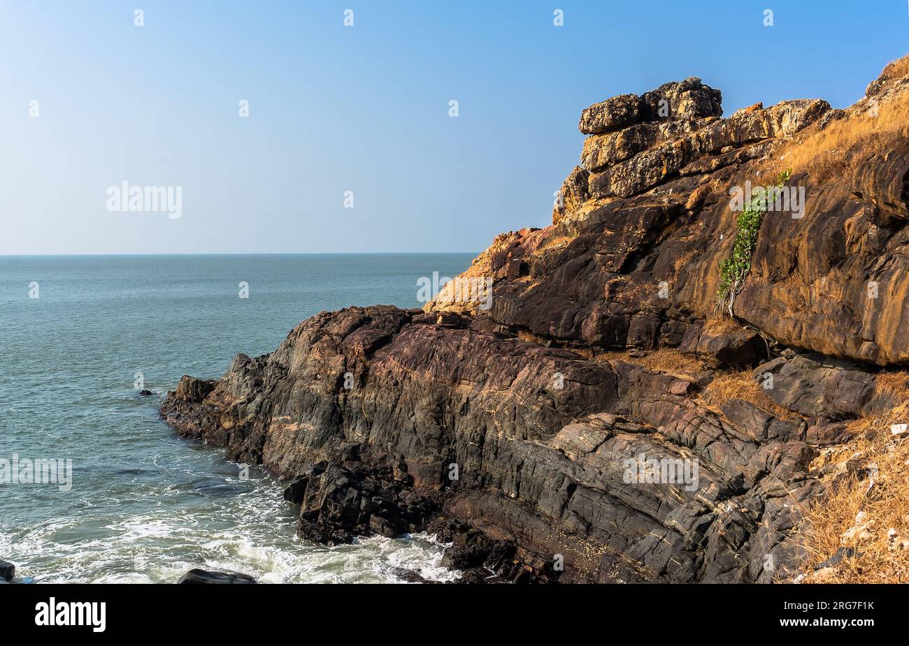 Beautiful seashore with sea wave over rocks. Turquoise clean seawater ...