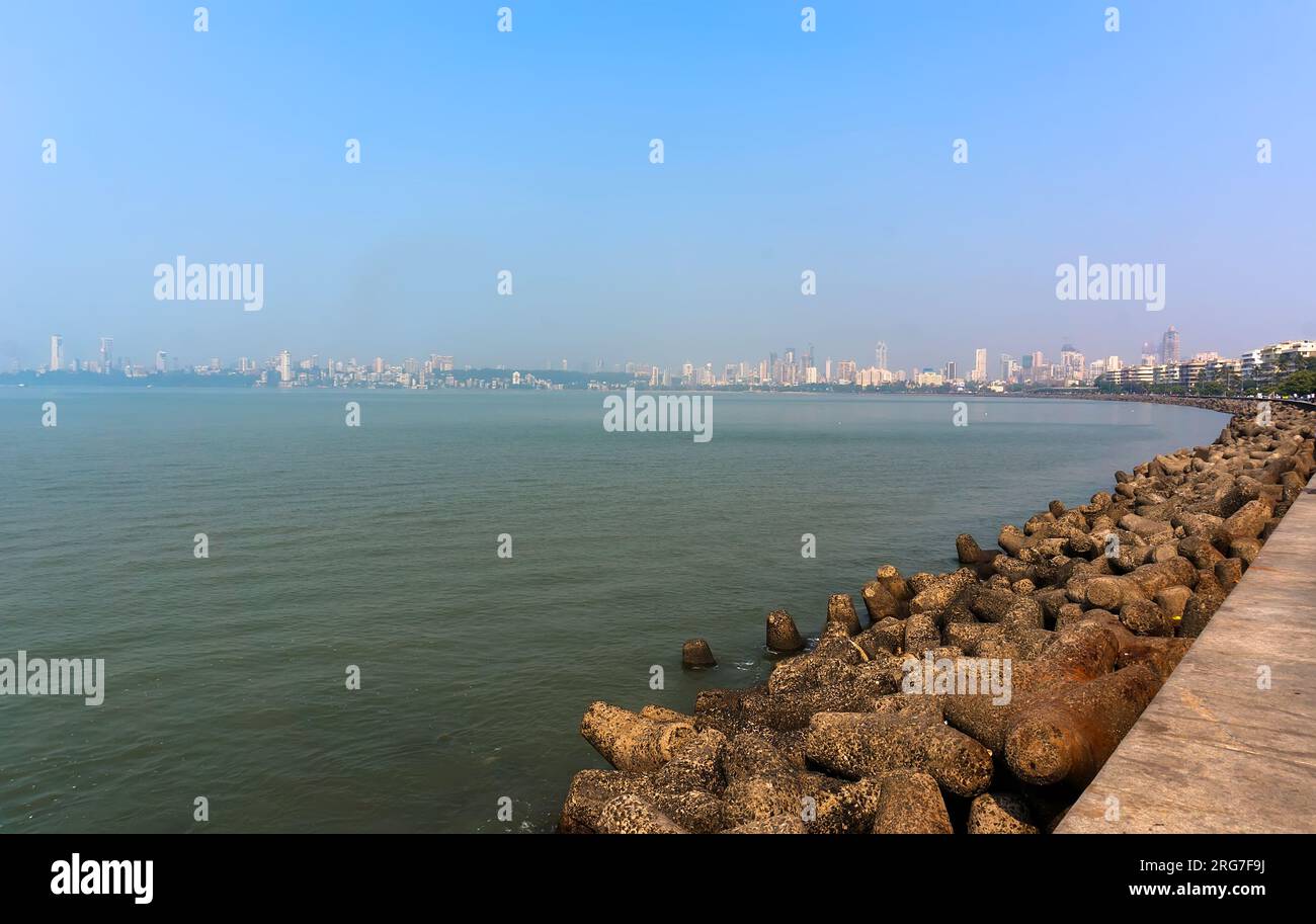 View of the embankment of Mumbai with large stones and sky. Bombay sea ...