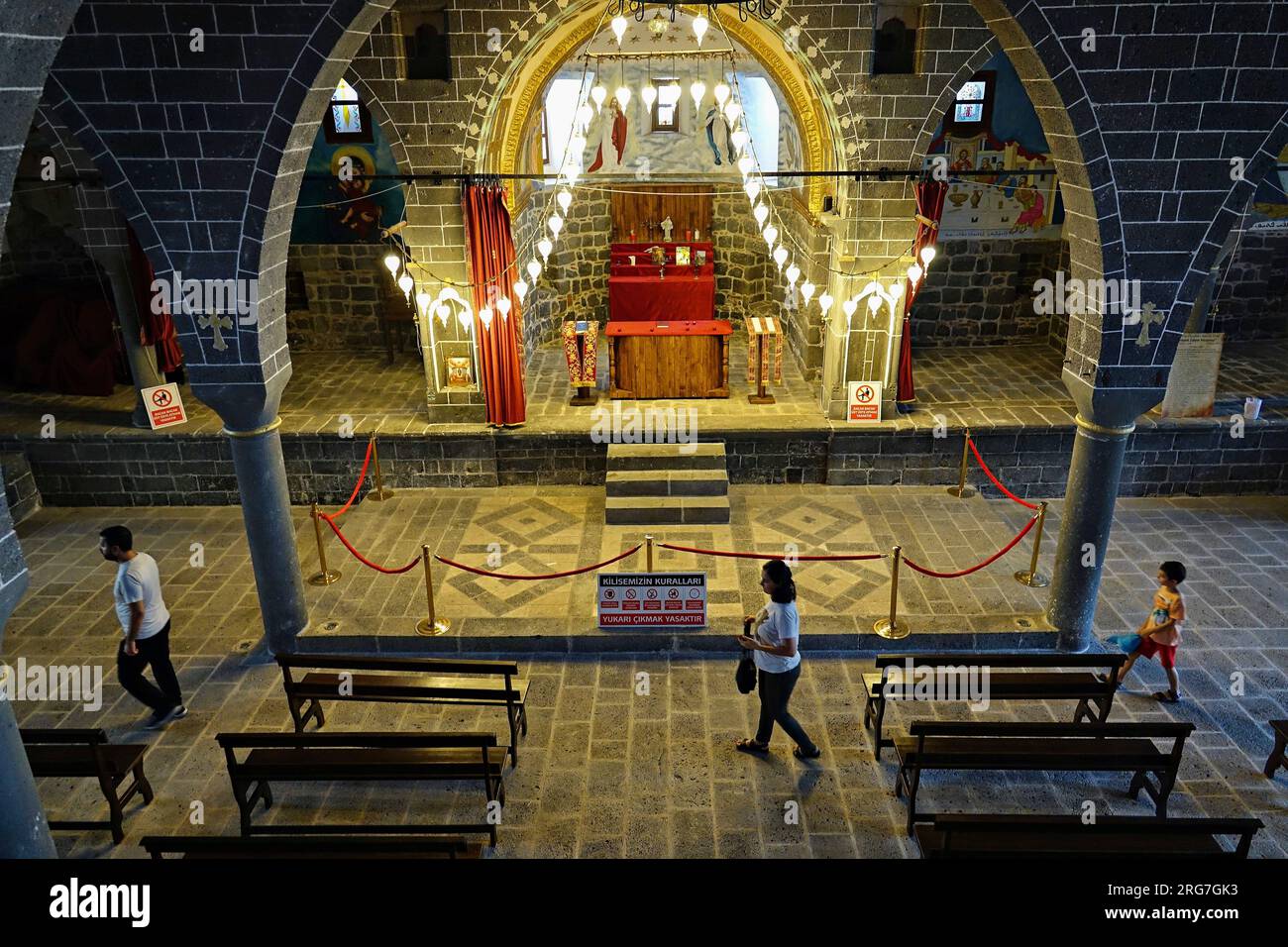 Tourists are seen visiting the St. Pithyon Church, where a clergyman ...