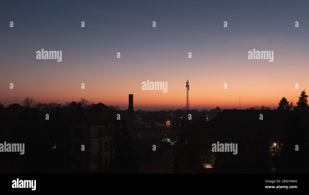 The contours of the buildings of the small town during the sunset Stock ...