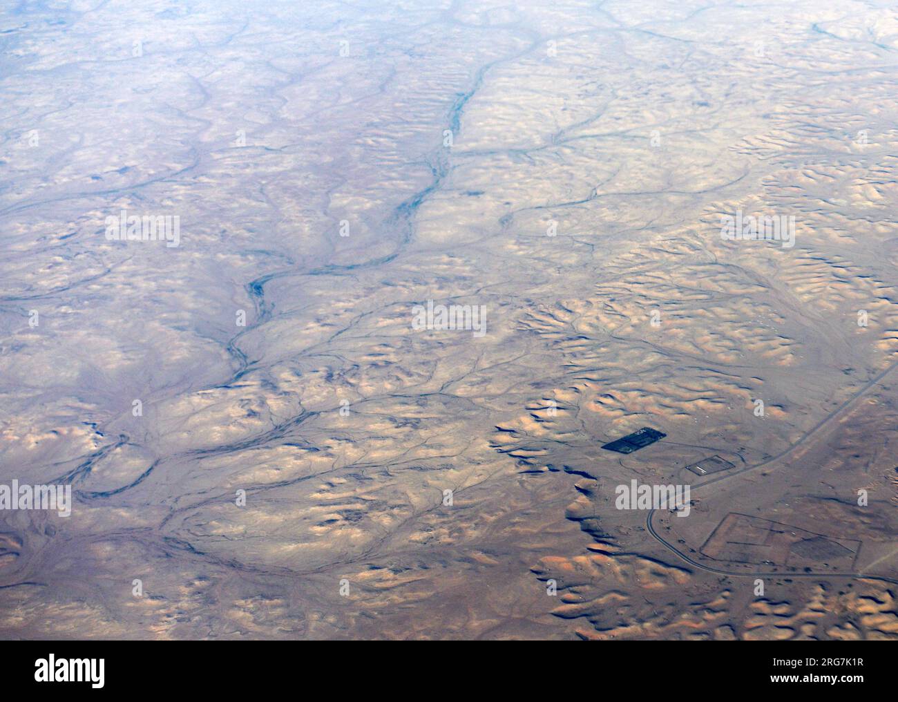 Aerial view of the Jordanian desert with small agricultural farms in ...