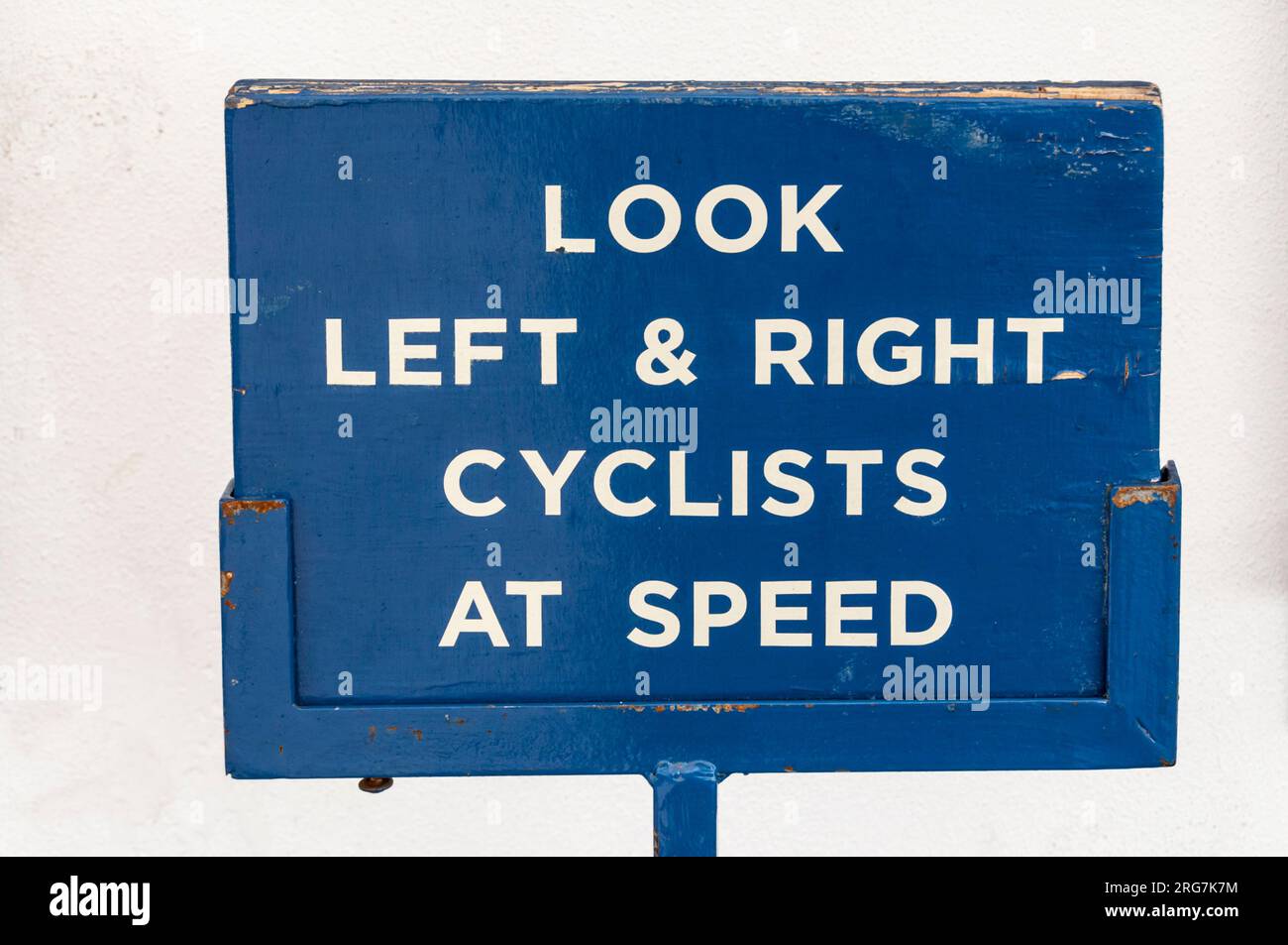 A sign in Hammersmith reads Look Left & Right Cyclists At Speed Stock ...