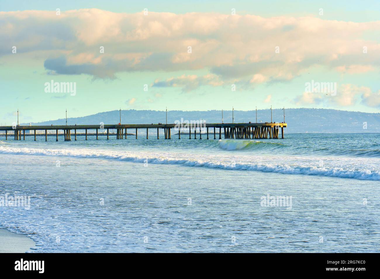 View of the Venice Beach Pier stretching into the endless expanse of ...