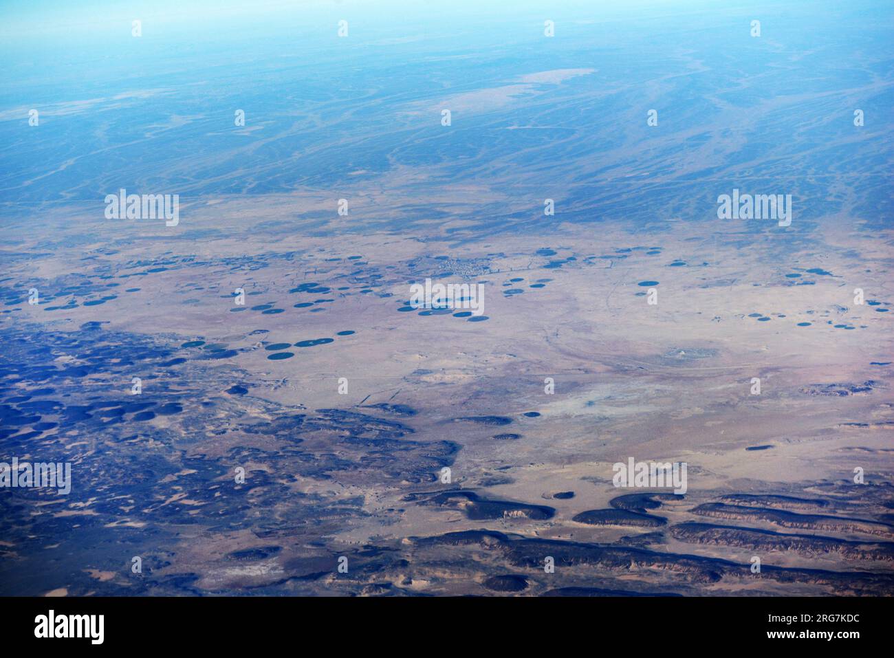 Aerial view of circular agriculture fields in the Arabian desert in ...