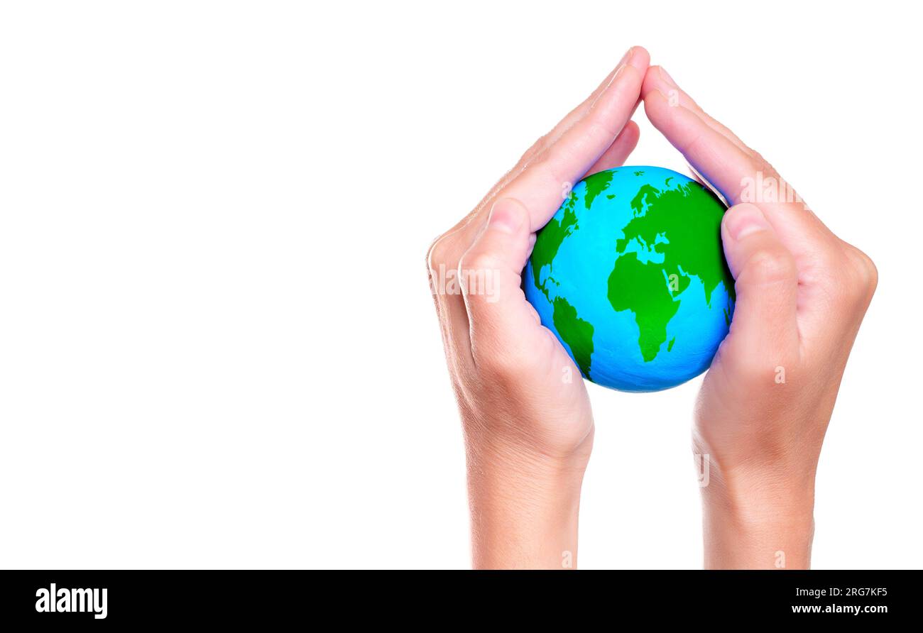 Close-up view of a small green and blue globe cradled between hands ...