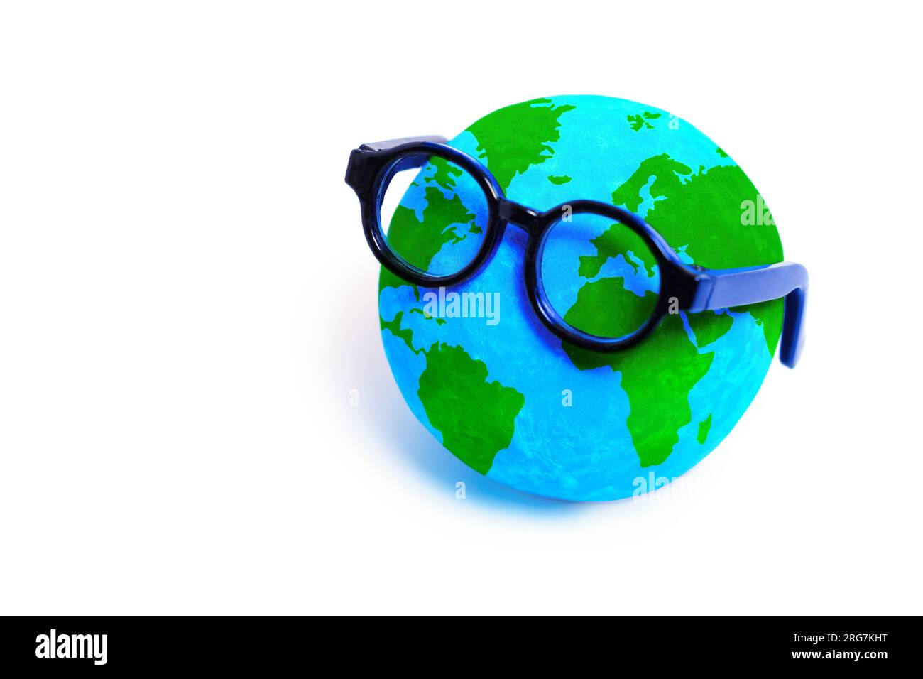 Miniature globe wearing glasses, representing the concept of education ...