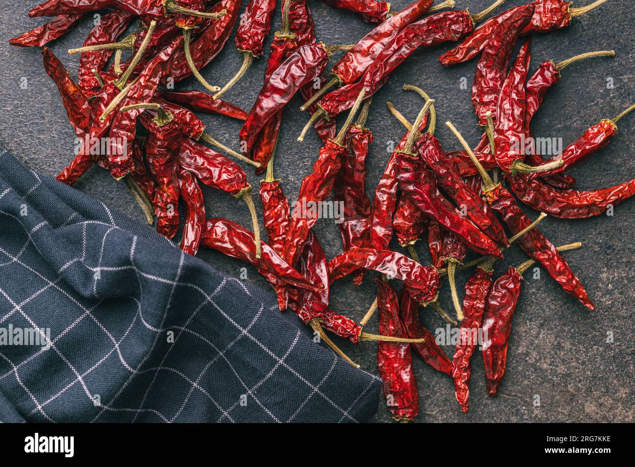 Red chili peppers on the kitchen table. Top view Stock Photo - Alamy