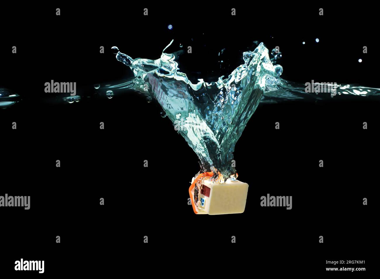 Close-up of a miniature wooden house model dropped underwater with ...