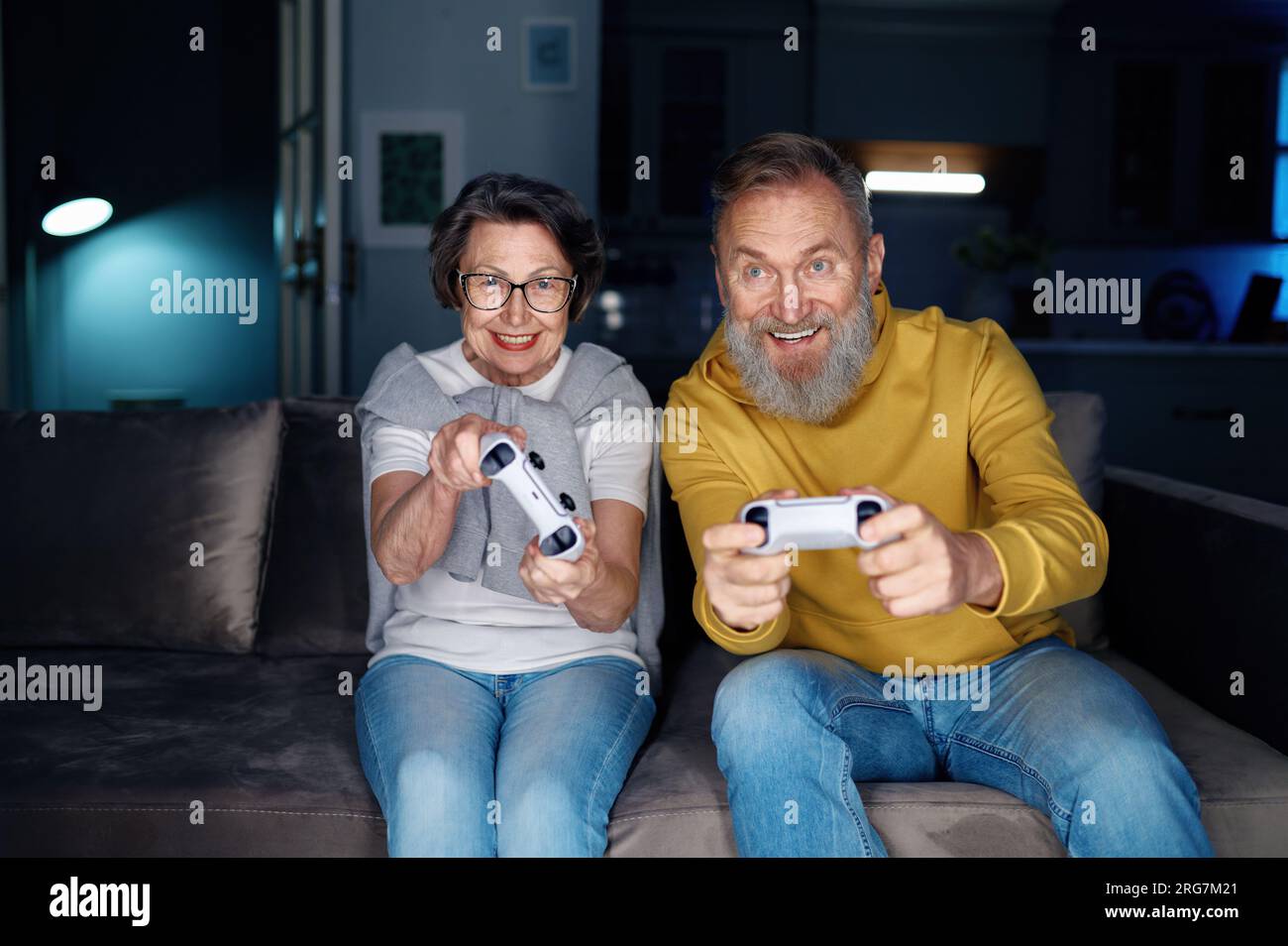 Old couple playing video games hi-res stock photography and images - Alamy
