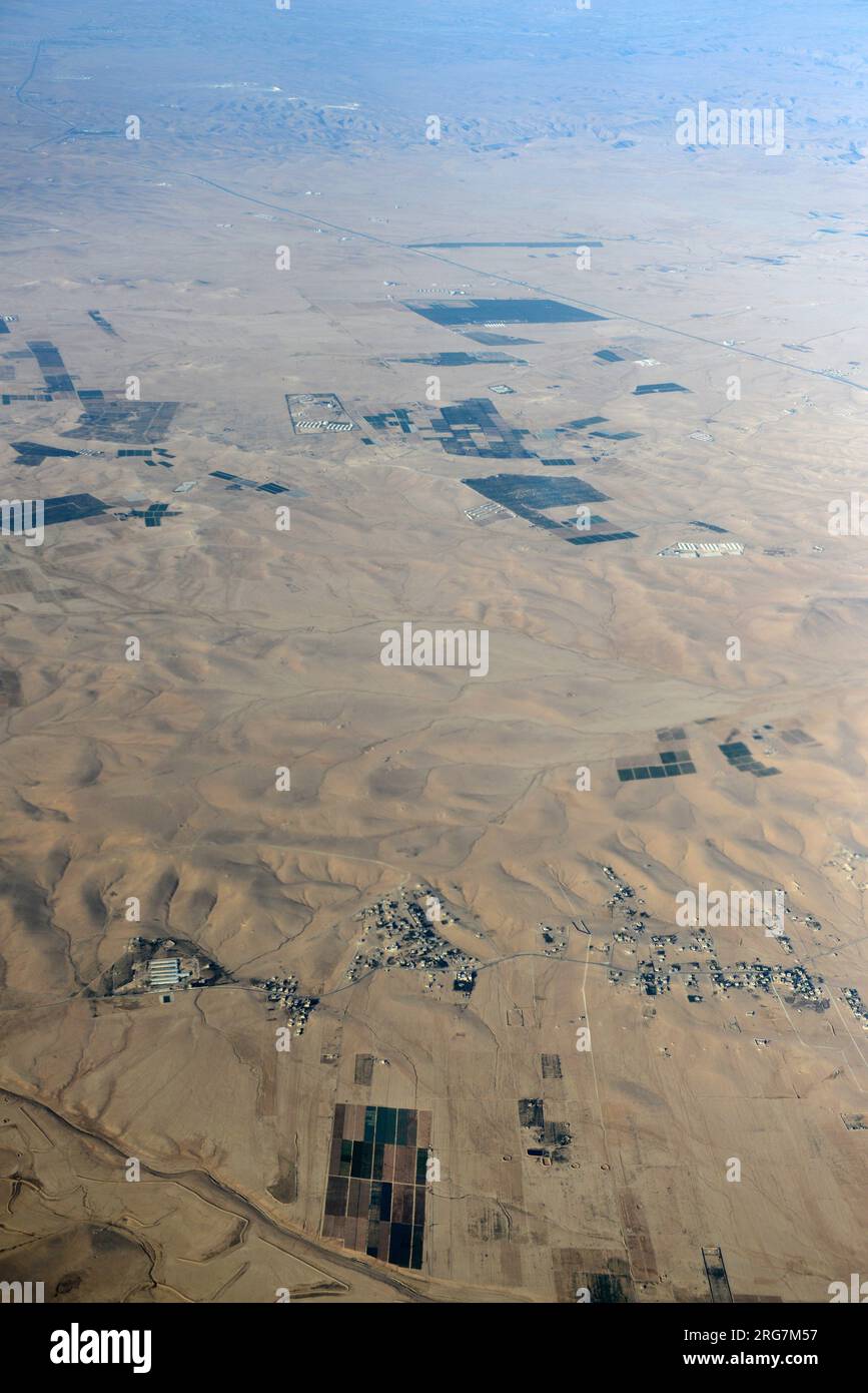 Aerial view of the Jordanian desert with small agricultural farms in ...