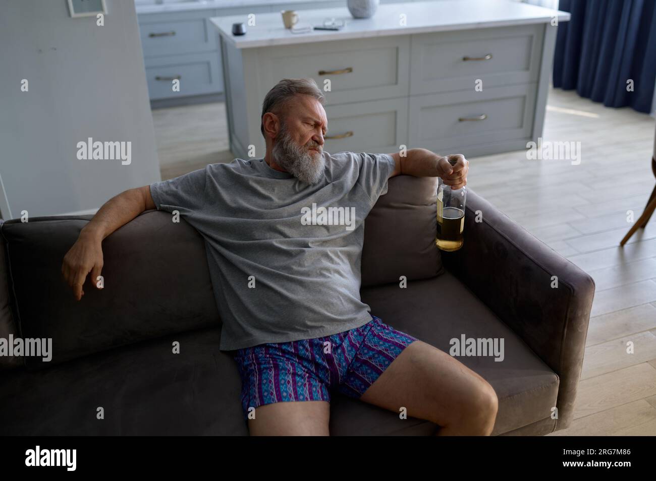 Drunk senior man looking at camera with angry rage emotion on face ...