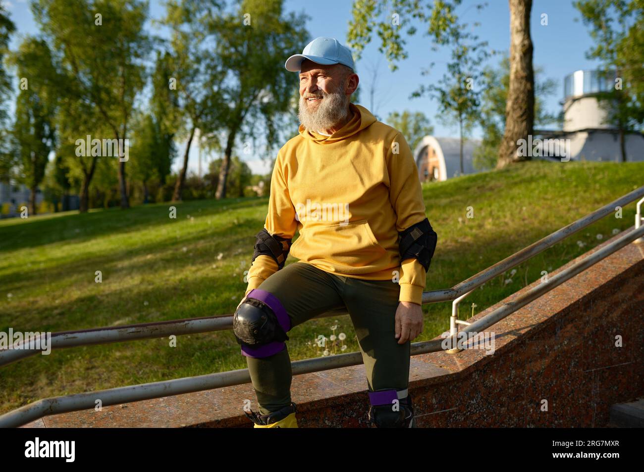 Senior man wearing roller skates rest sitting on stair railing Stock ...