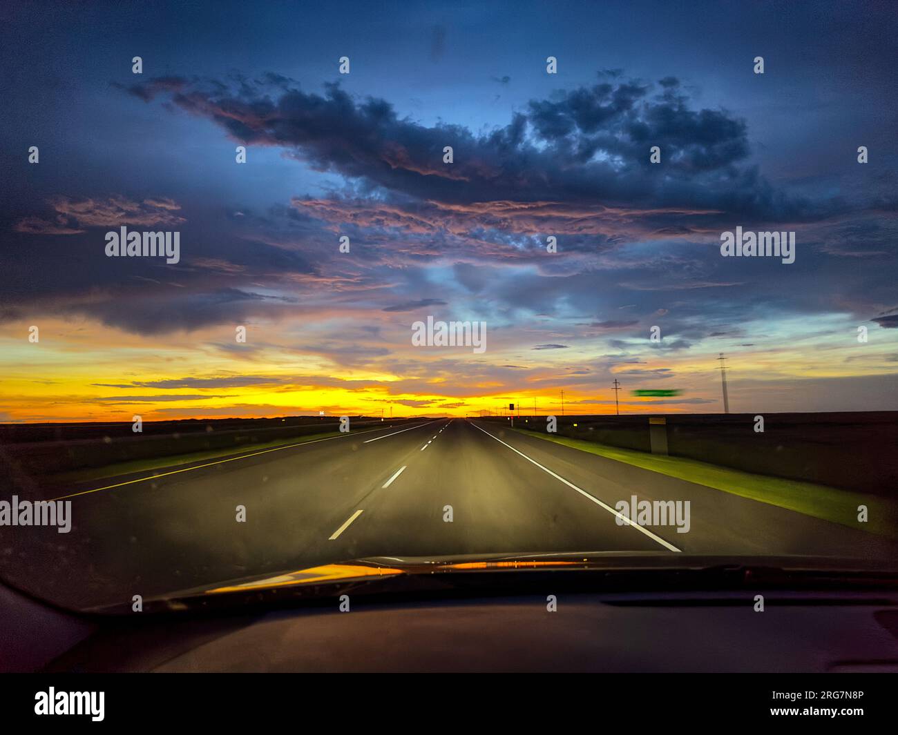 Driving into the sunset photo Stock Photo - Alamy