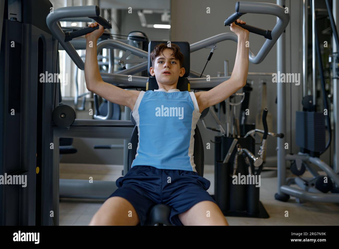 Active teenager boy doing physical exercise for masculinity development ...