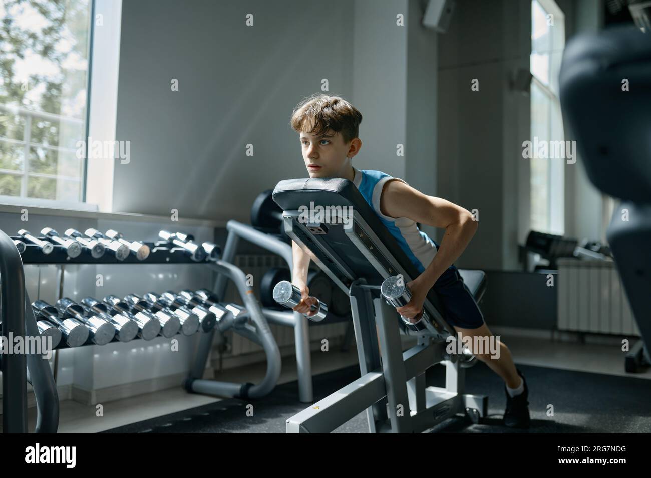 Teenage boy weight lifting hi-res stock photography and images - Alamy