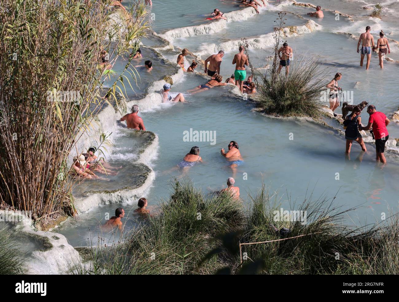 Saturnia, Italy - September 13, 2022: People are bathing in the hot ...