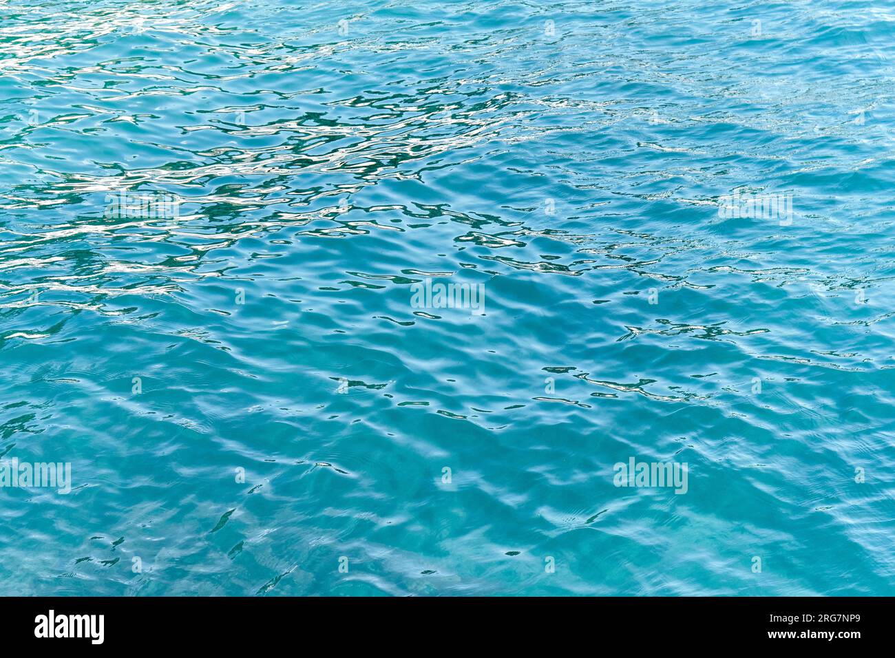 Closeup seascape surface of blue sea water with small ripple waves on ...
