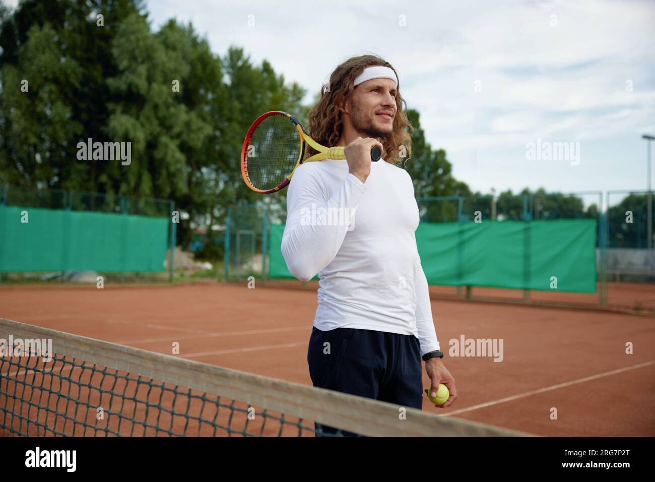 Determined male tennis player wearing hi-res stock photography and ...