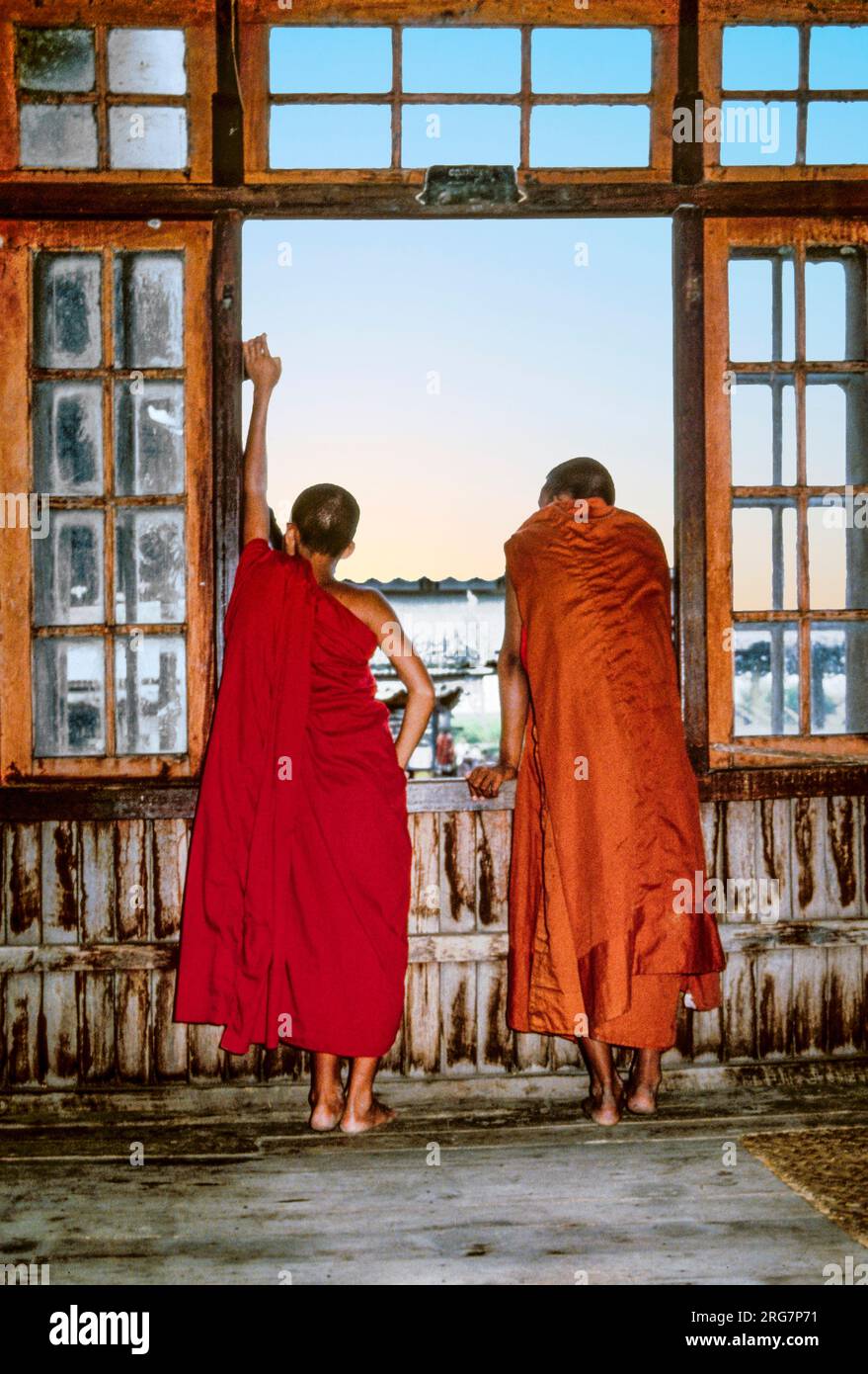 Inle lake, Myanmar - March 5, 1984: two monks in the monastery look out ...