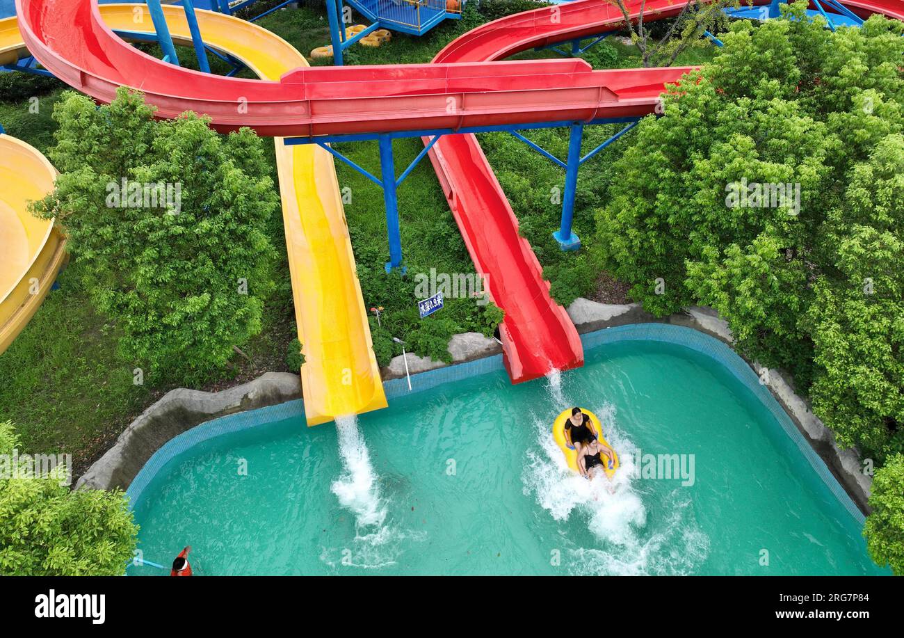 Aerial photo shows people playing at a water park in Yangzhou City ...