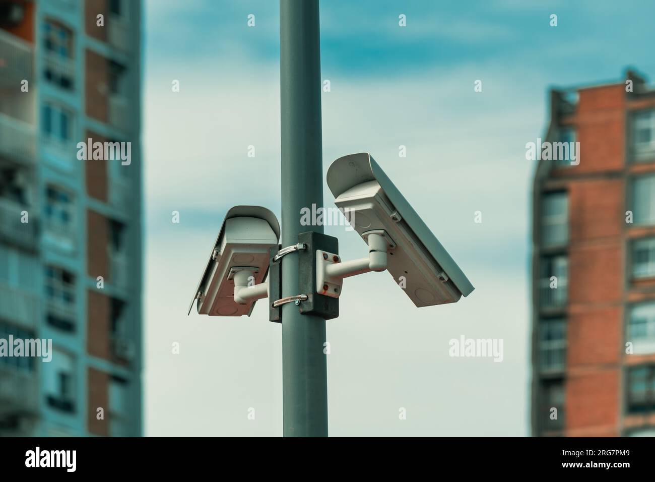 Surveillance camera in urban residential district with brutalist ...