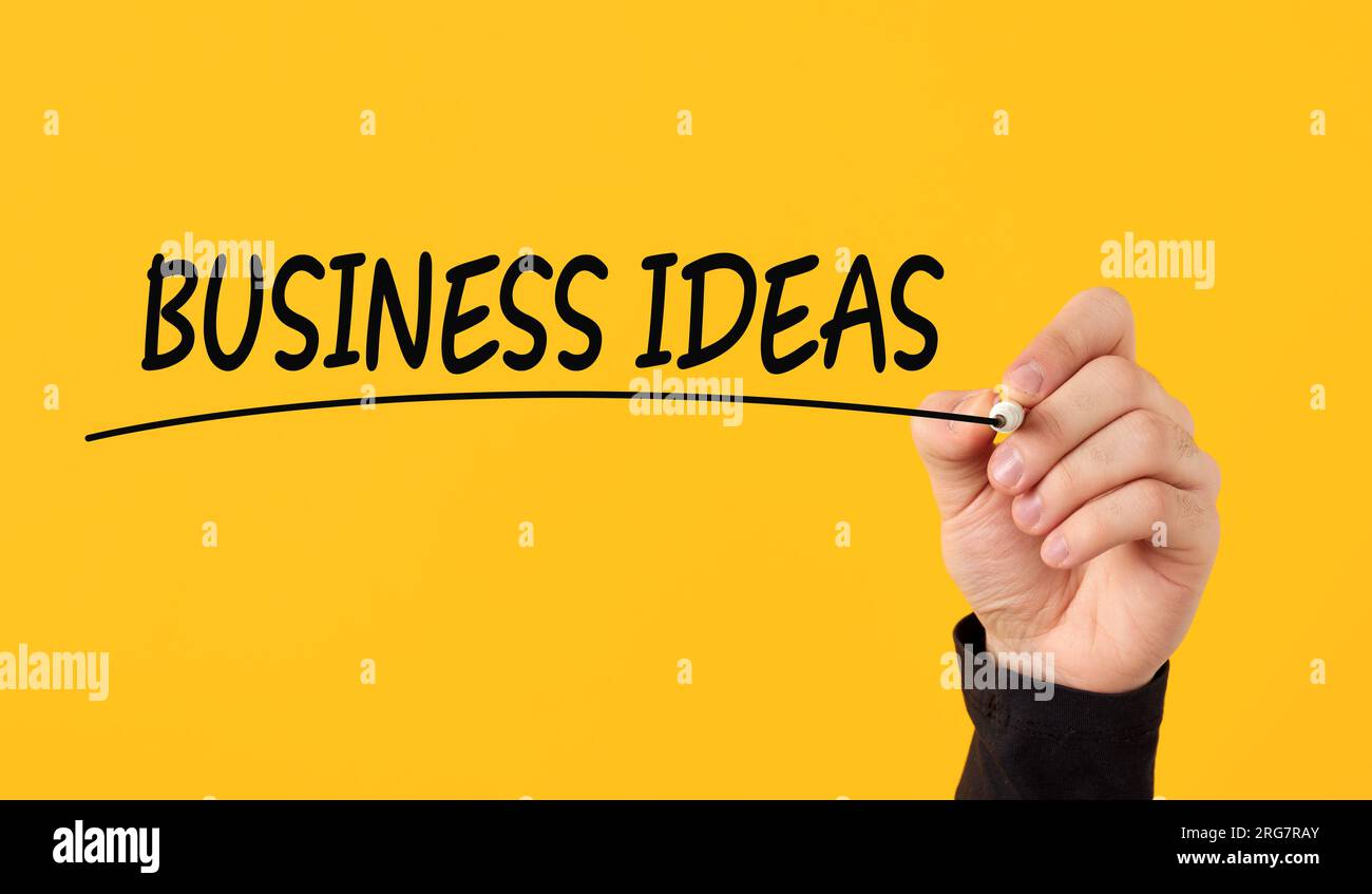 Creative business ideas concept. Male hand draws a line under the word ...