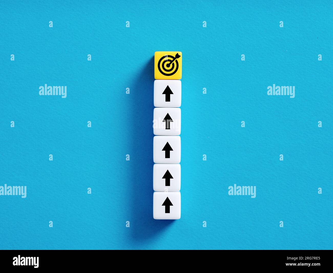 Achieving goals and objectives. Colorful cubes with arrow and target ...