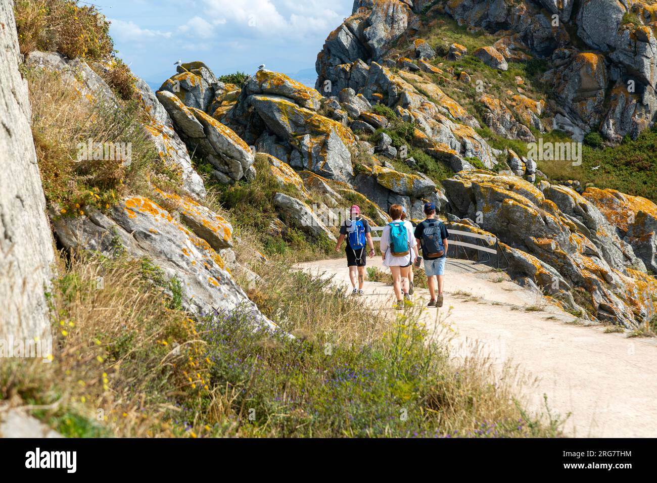 People walking on pathway, Isla del Faro, Cies Islands, Atlantic ...