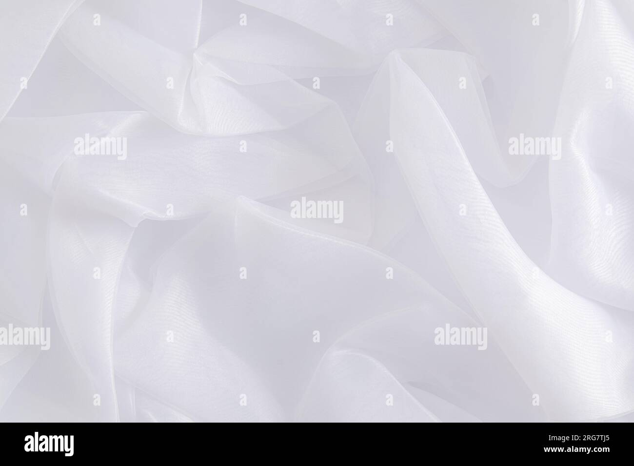 delicate folds of the bride's white silk dress. Beautiful fabric white ...