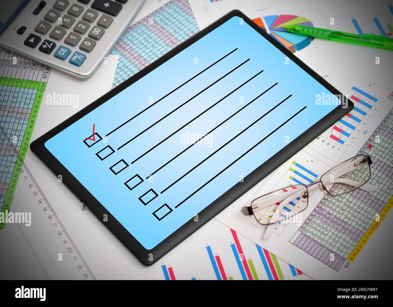 tablen with checklist and financial statements on table Stock Photo - Alamy
