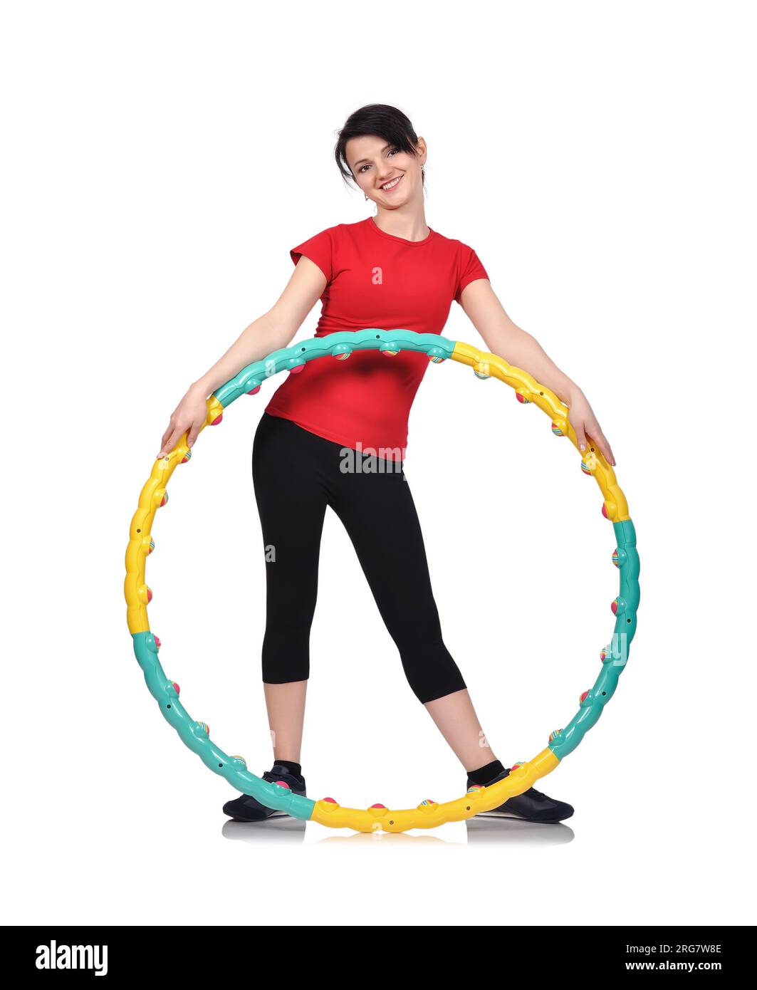 girl holding color hula hoop on white background Stock Photo - Alamy