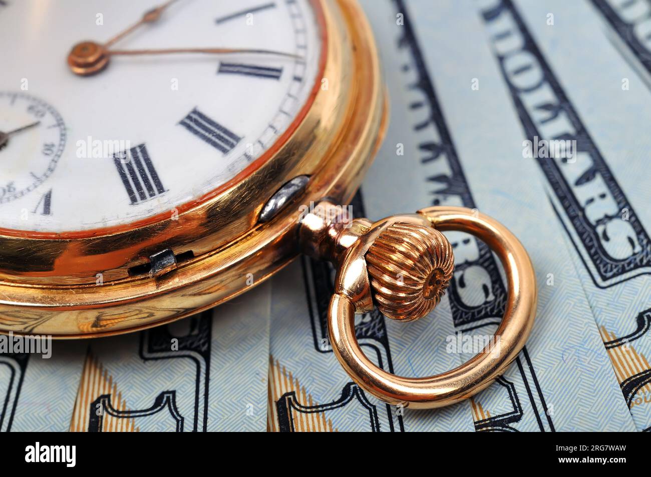 gold pocket watch and dollars, close up Stock Photo - Alamy